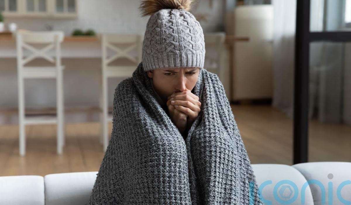 Ways to keep warm at home without cranking up the central heating – as ...