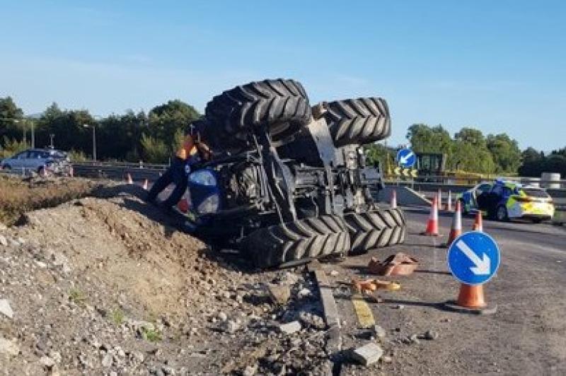 Tractor driver has lucky escape after toppling vehicle on motorway ...