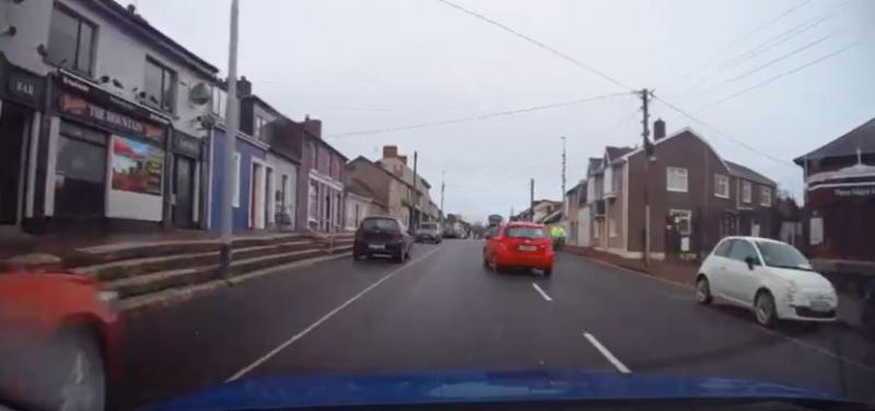 WATCH: Terrifying moment 'maniac' driver nearly collides with cyclist before running red light ...